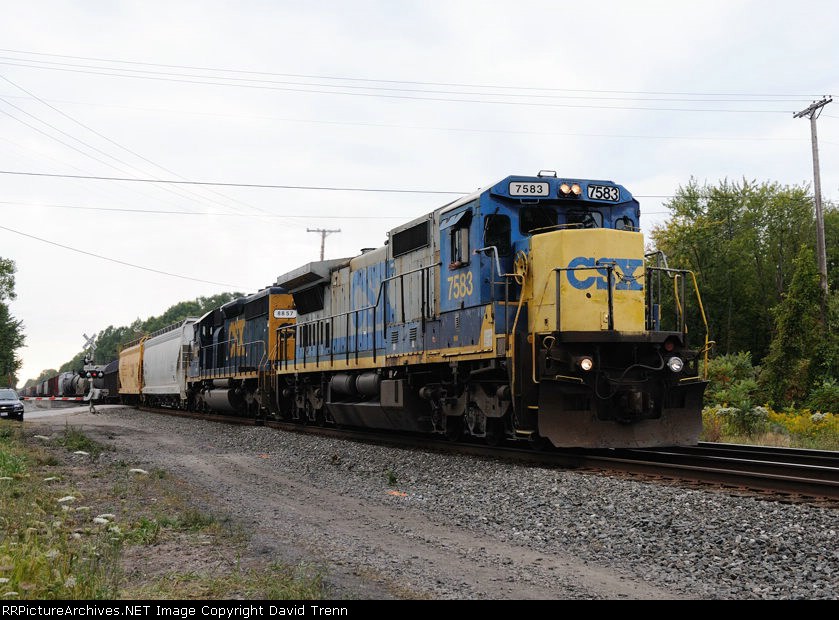 CSX 7583 leads Eastbound CSX Q386 at MP132.5 on track number two.